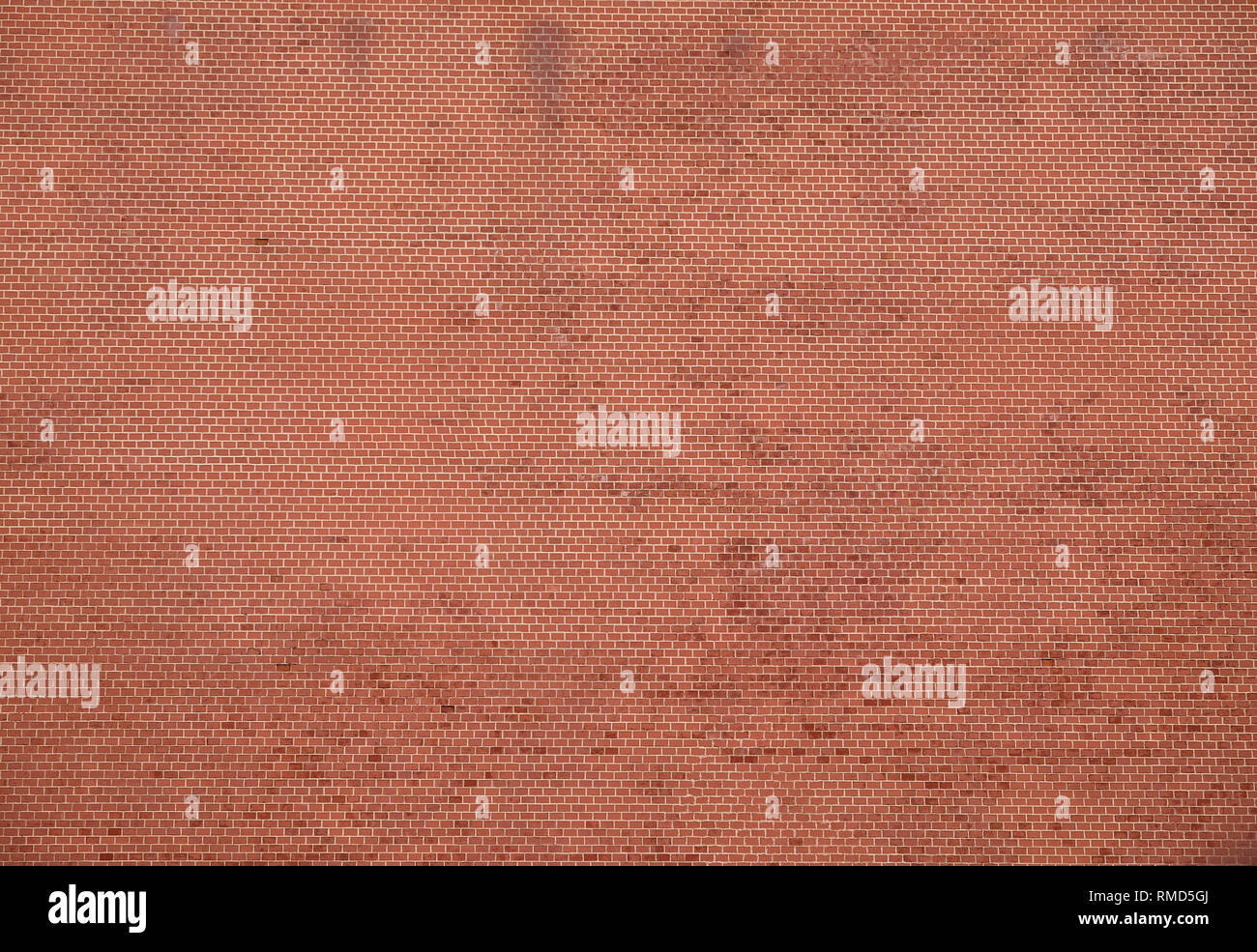 Wall from many small red bricks as background front view horizontal ...