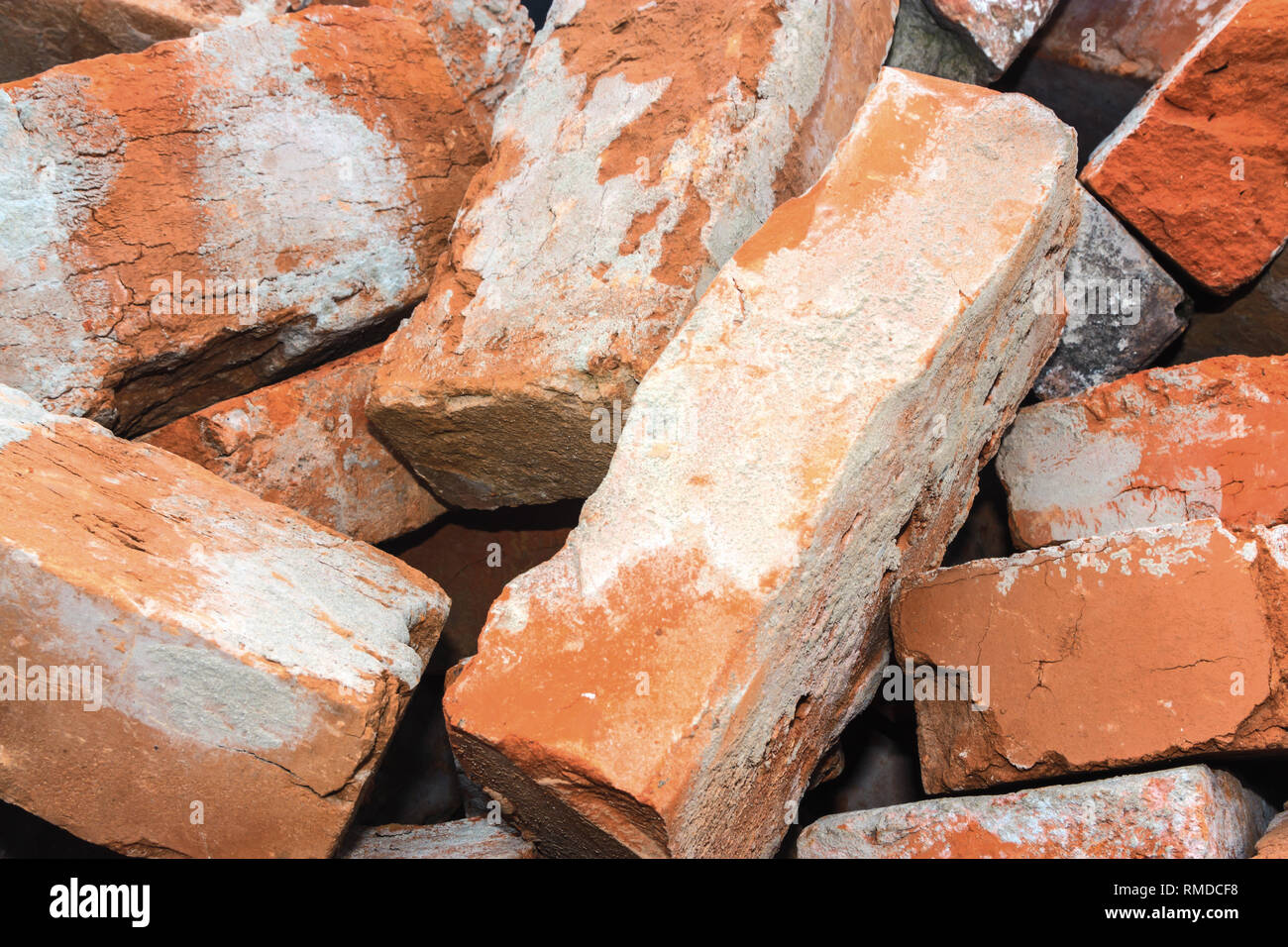 Pile of old red bricks on background Stock Photo - Alamy