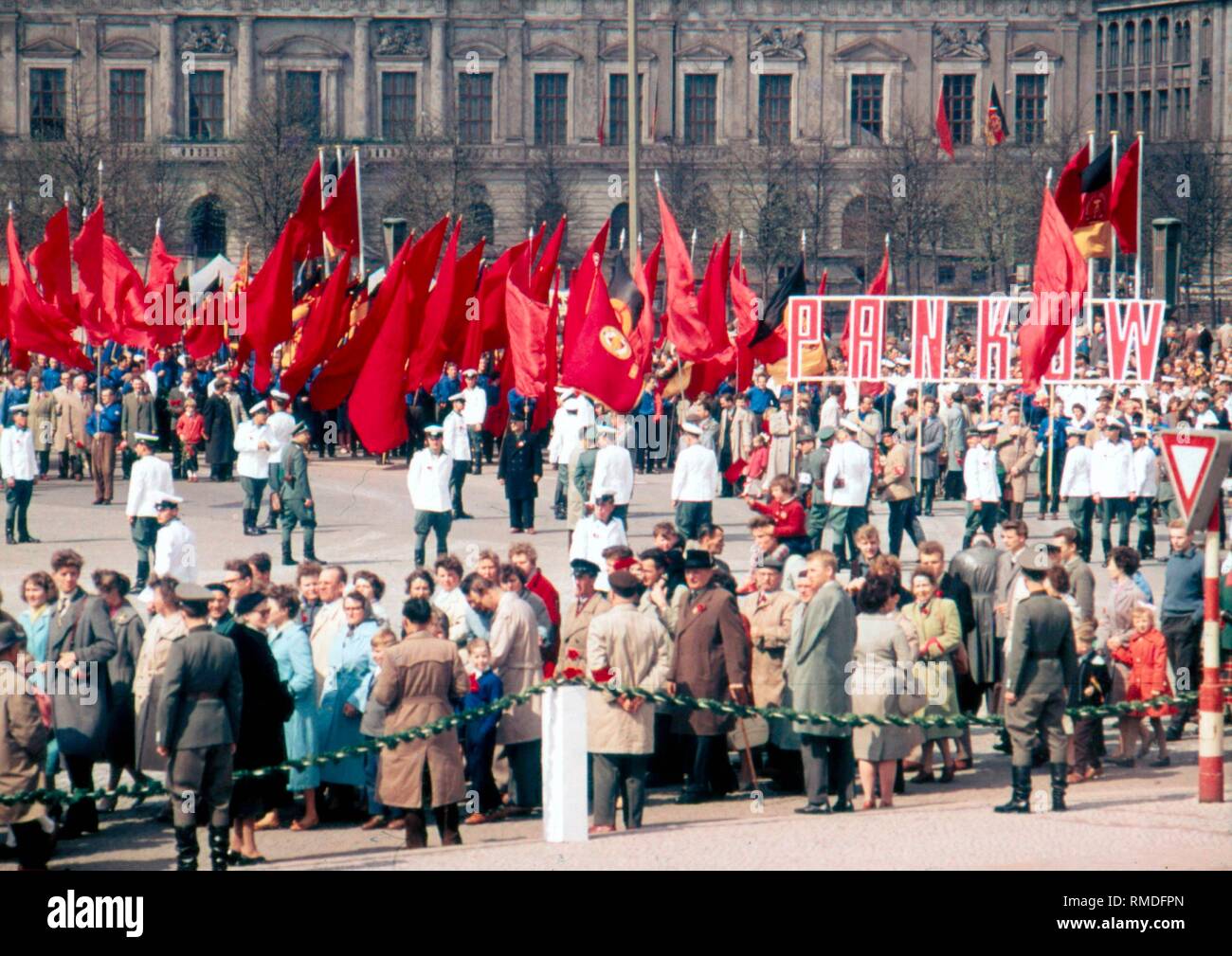 People with red flags participate in the rally on May 1, 1959 on Marx ...