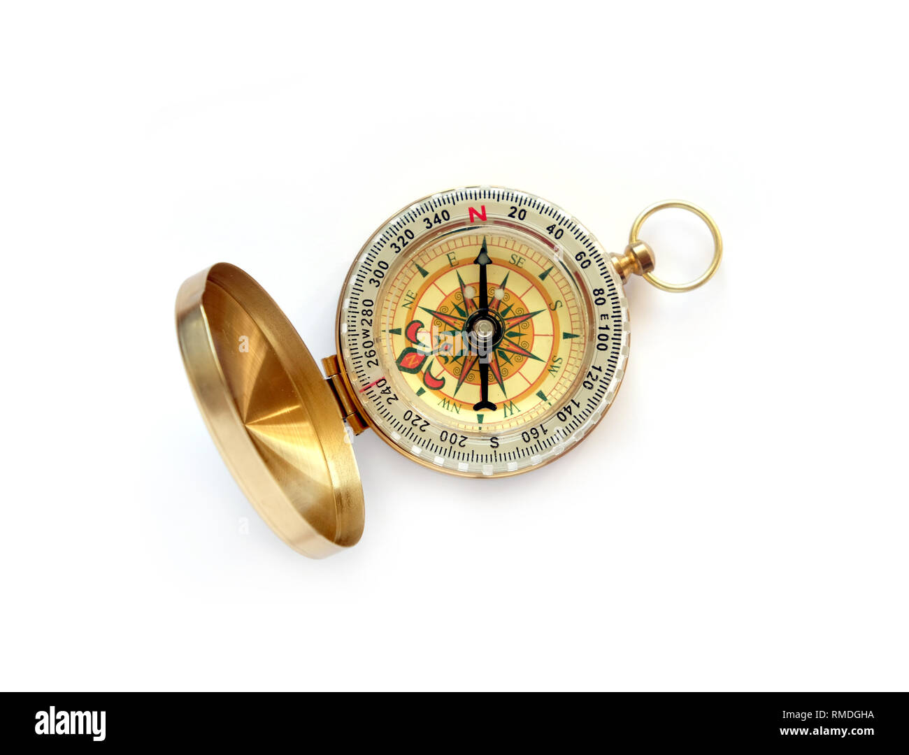 Vintage compass in opened brass case on isolated on white shown to ...