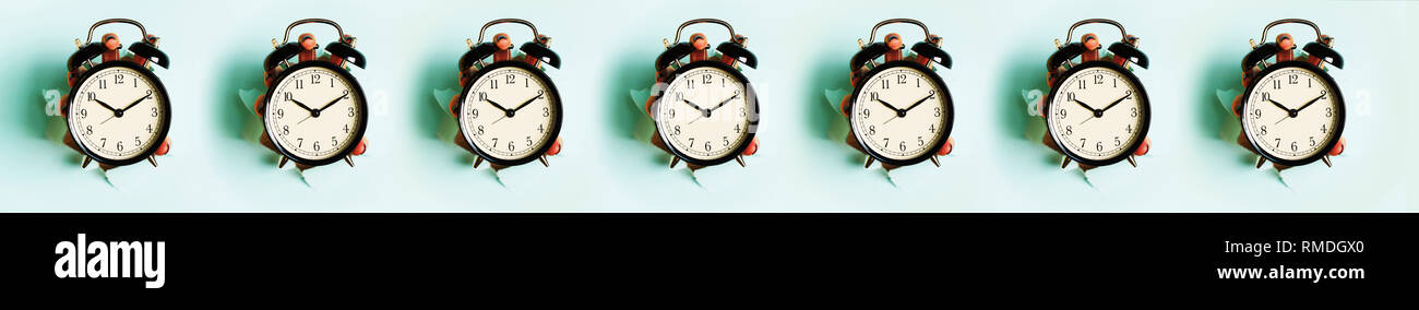 Seamless pattern of hands holding black alarm clock through hole in ...