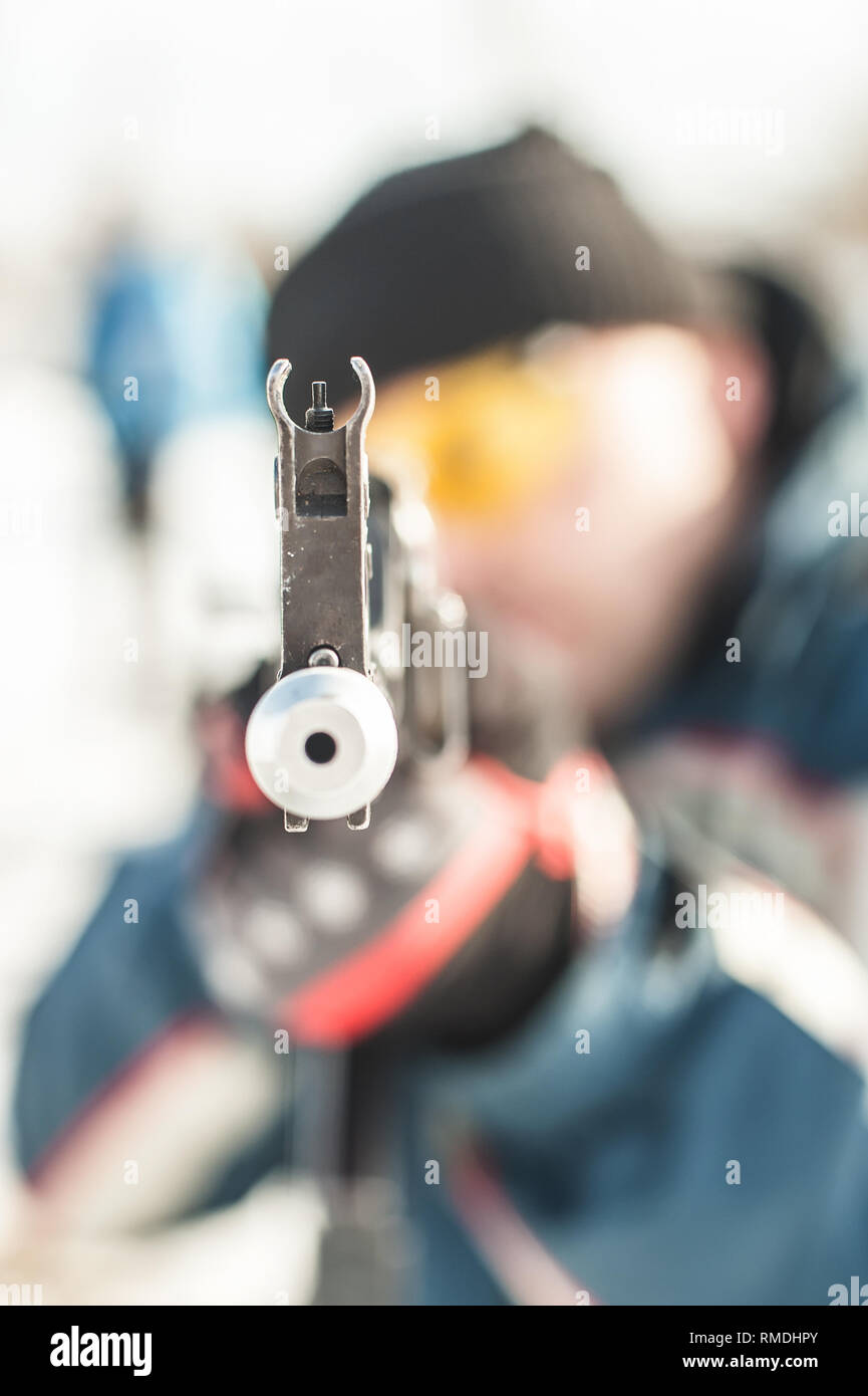 Direct macro detail close-up front view gun point of riffle machine gun ...