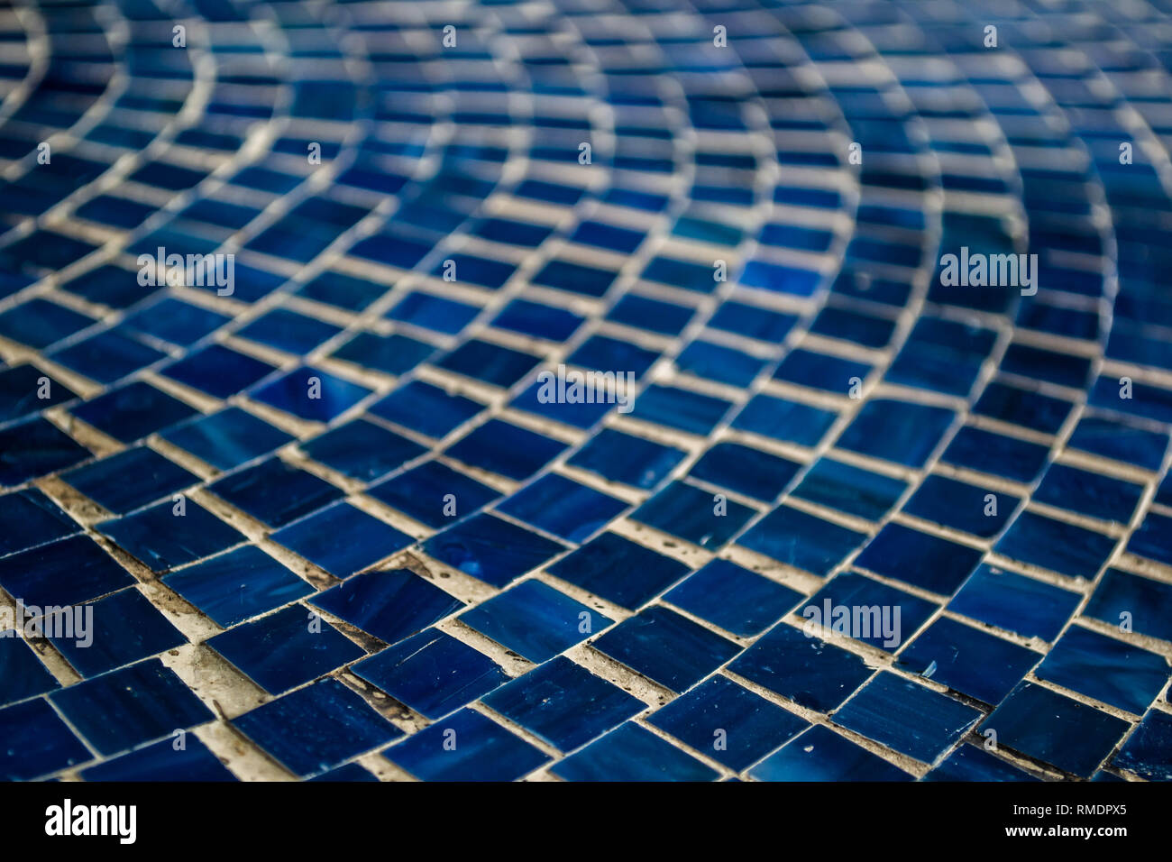 Small blue mosaic tiles in a circular pattern Stock Photo - Alamy