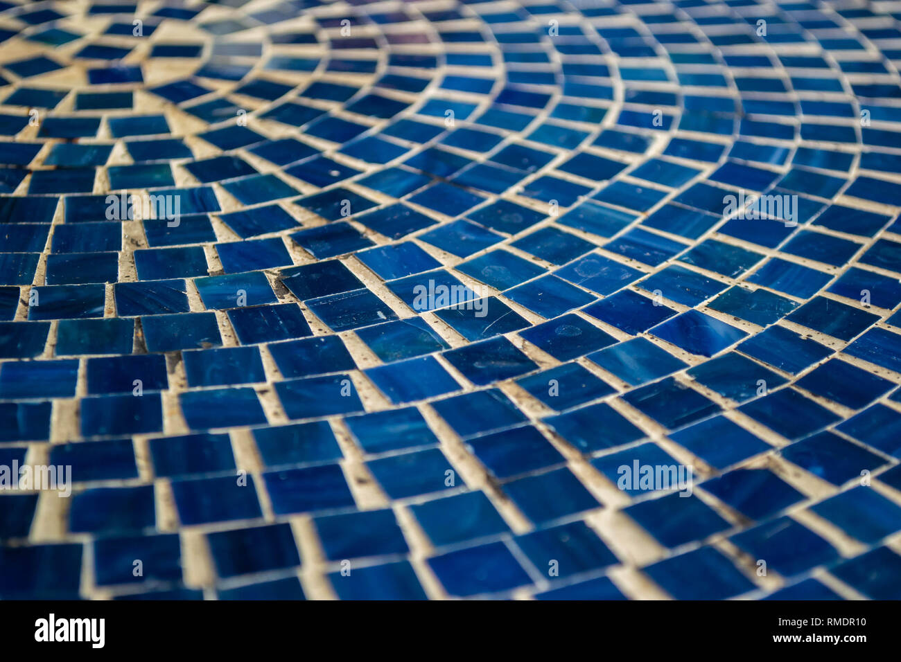 Small blue mosaic tiles in a circular pattern Stock Photo - Alamy
