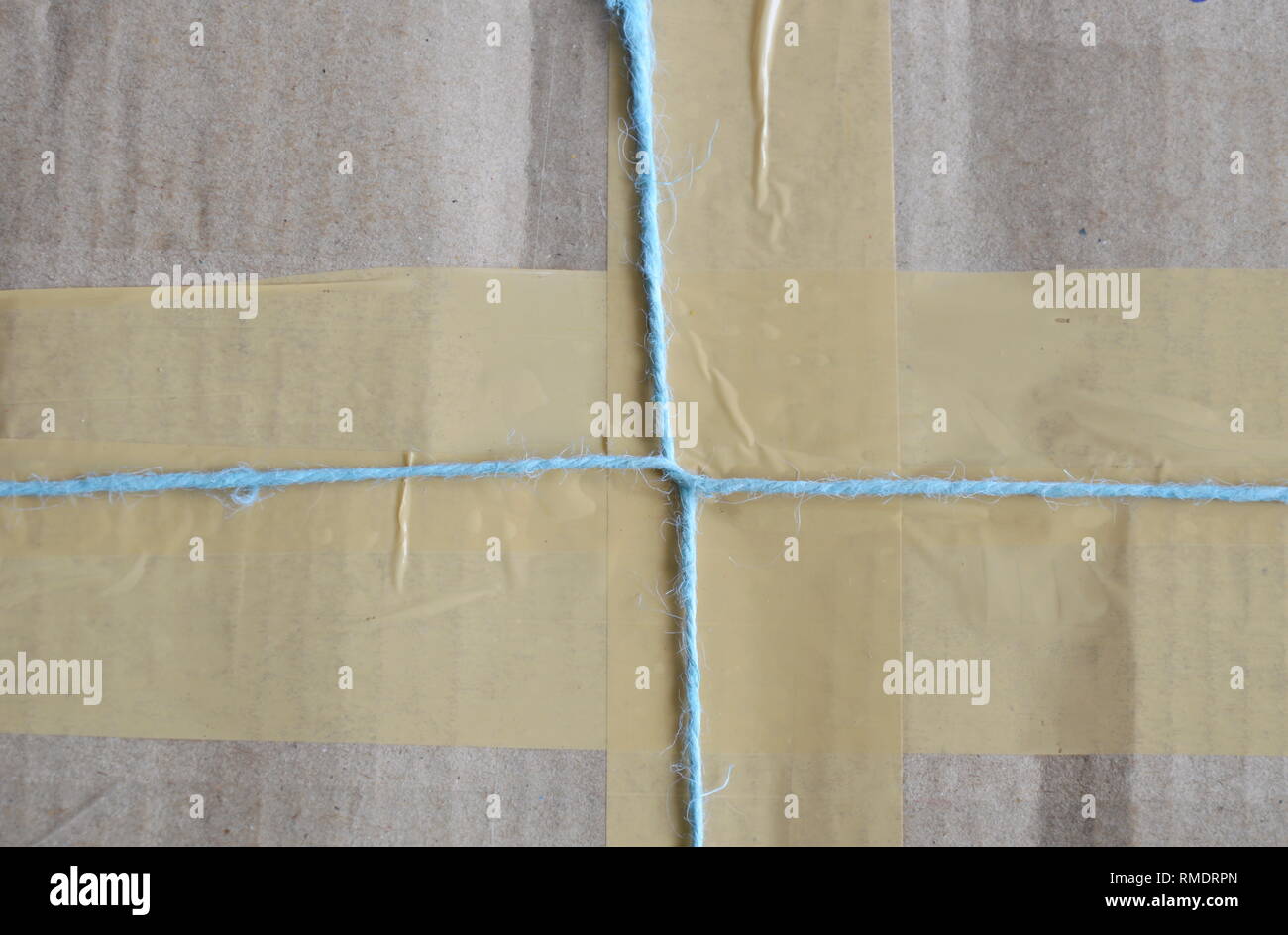 parcel rope tying around brown postbox Stock Photo - Alamy