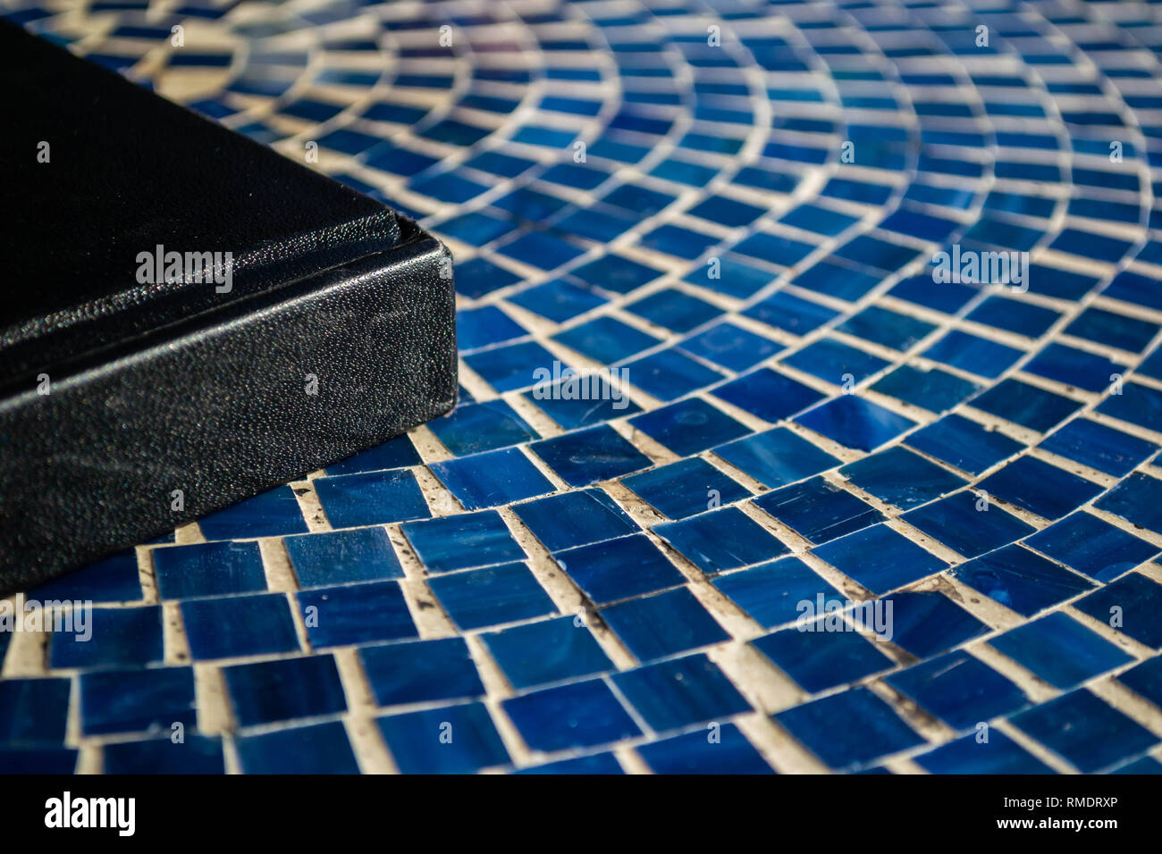 Small blue mosaic tiles in a circular pattern Stock Photo - Alamy