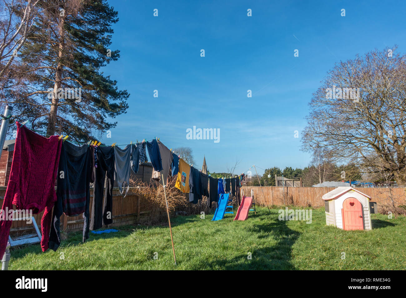 Laundry drying on a washing line on a warm winter day Stock Photo - Alamy