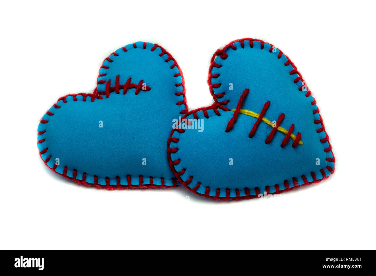 Hand stitched textile hearts isolated on white background for romantic ...