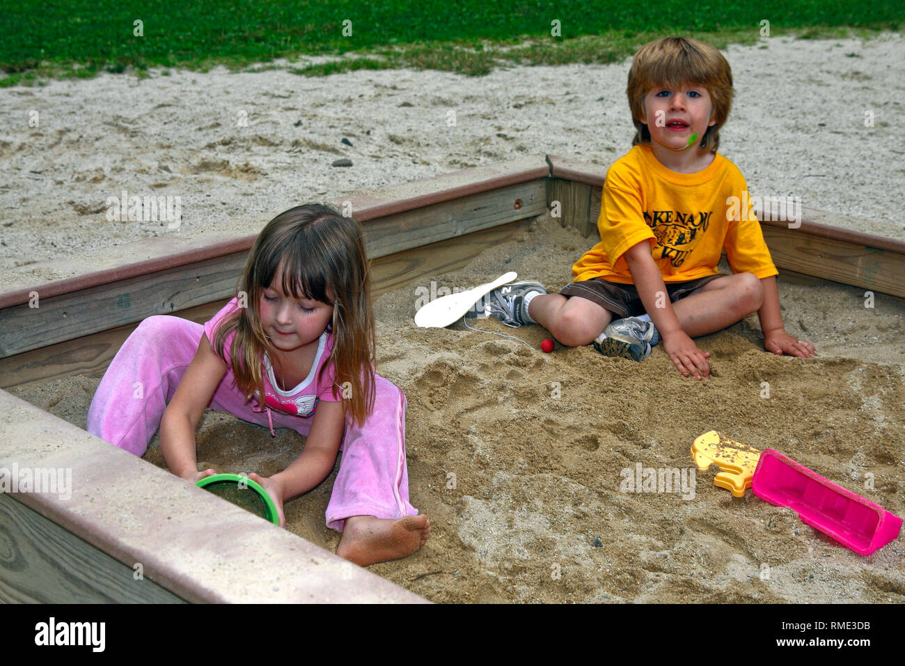 pre-school children, boy, girl, playing; sandbox; toys; fun; outdoors ...