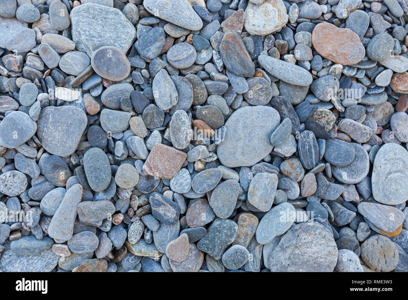 Round rocks on a beach Stock Photo - Alamy