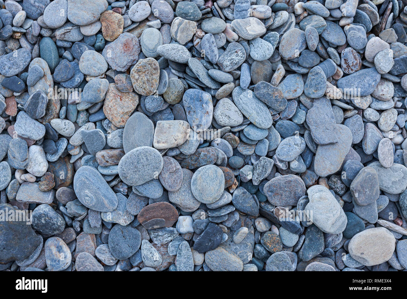Round rocks on a beach Stock Photo - Alamy