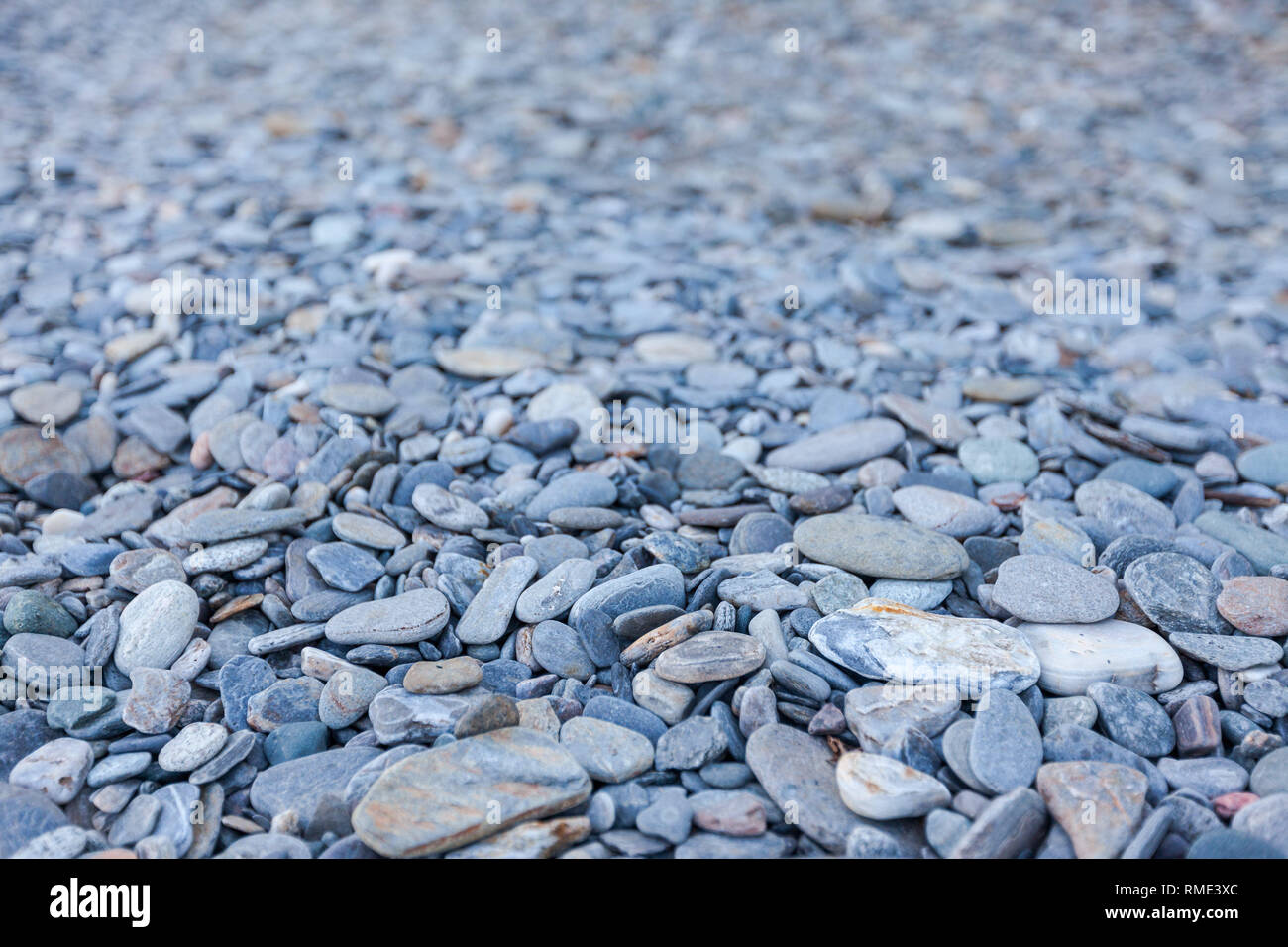 Round rocks on a beach Stock Photo - Alamy