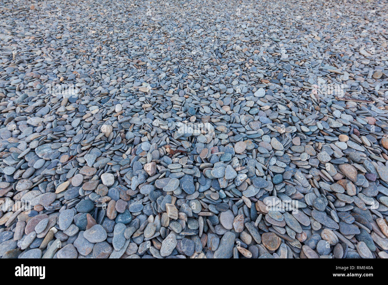 Round rocks on a beach Stock Photo - Alamy