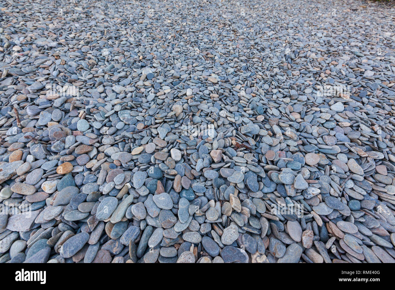 Round rocks on a beach Stock Photo - Alamy