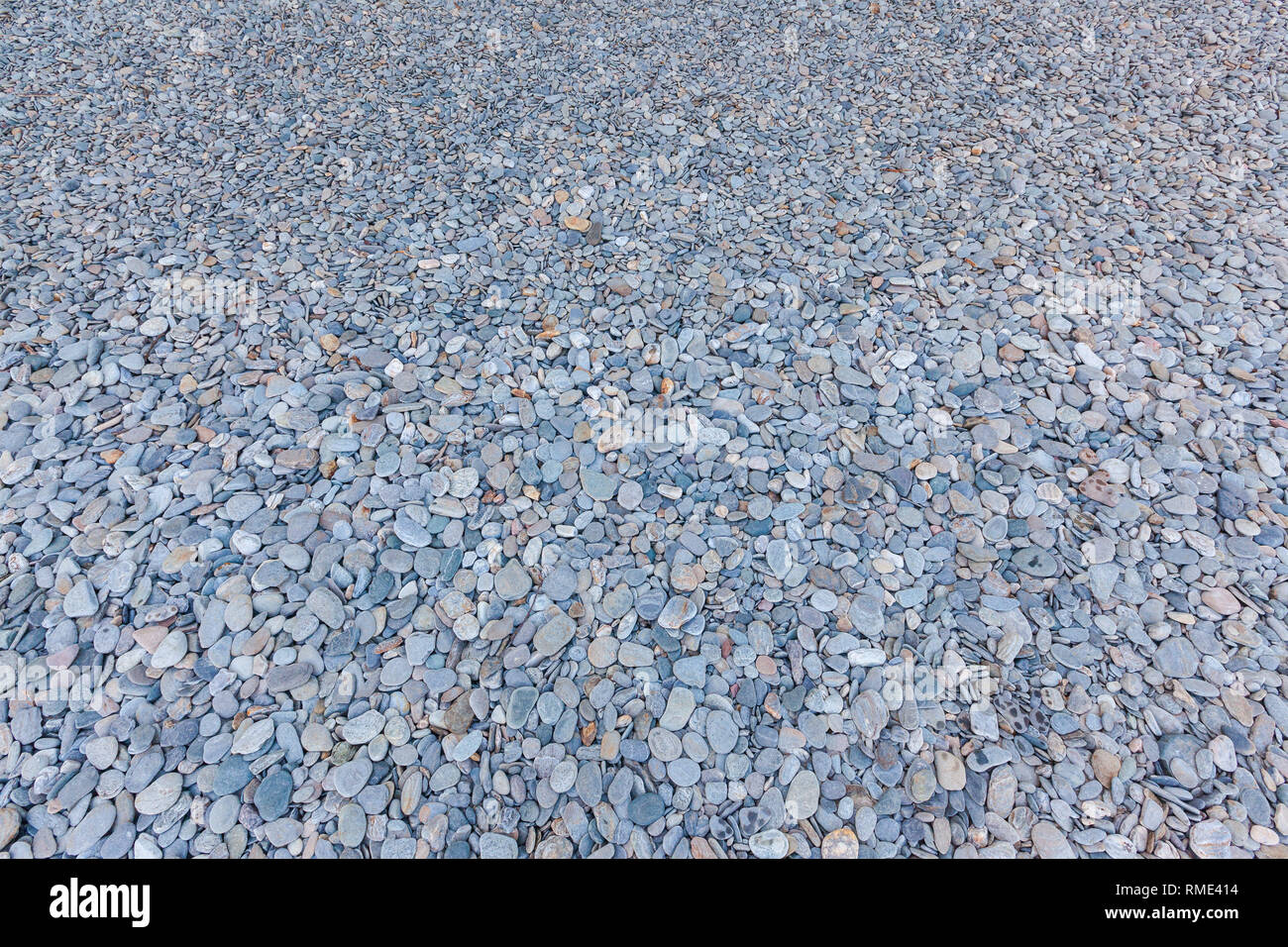 Round rocks on a beach Stock Photo - Alamy