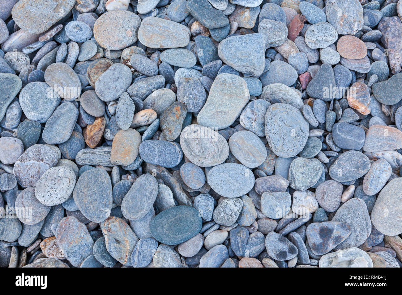 Round rocks on a beach Stock Photo - Alamy