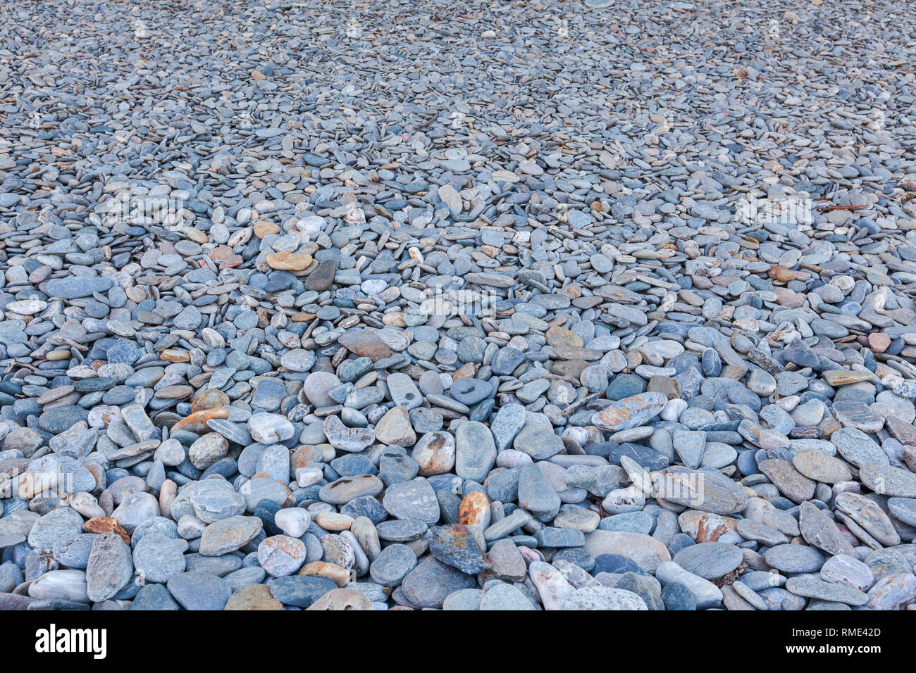 Round rocks on a beach Stock Photo - Alamy