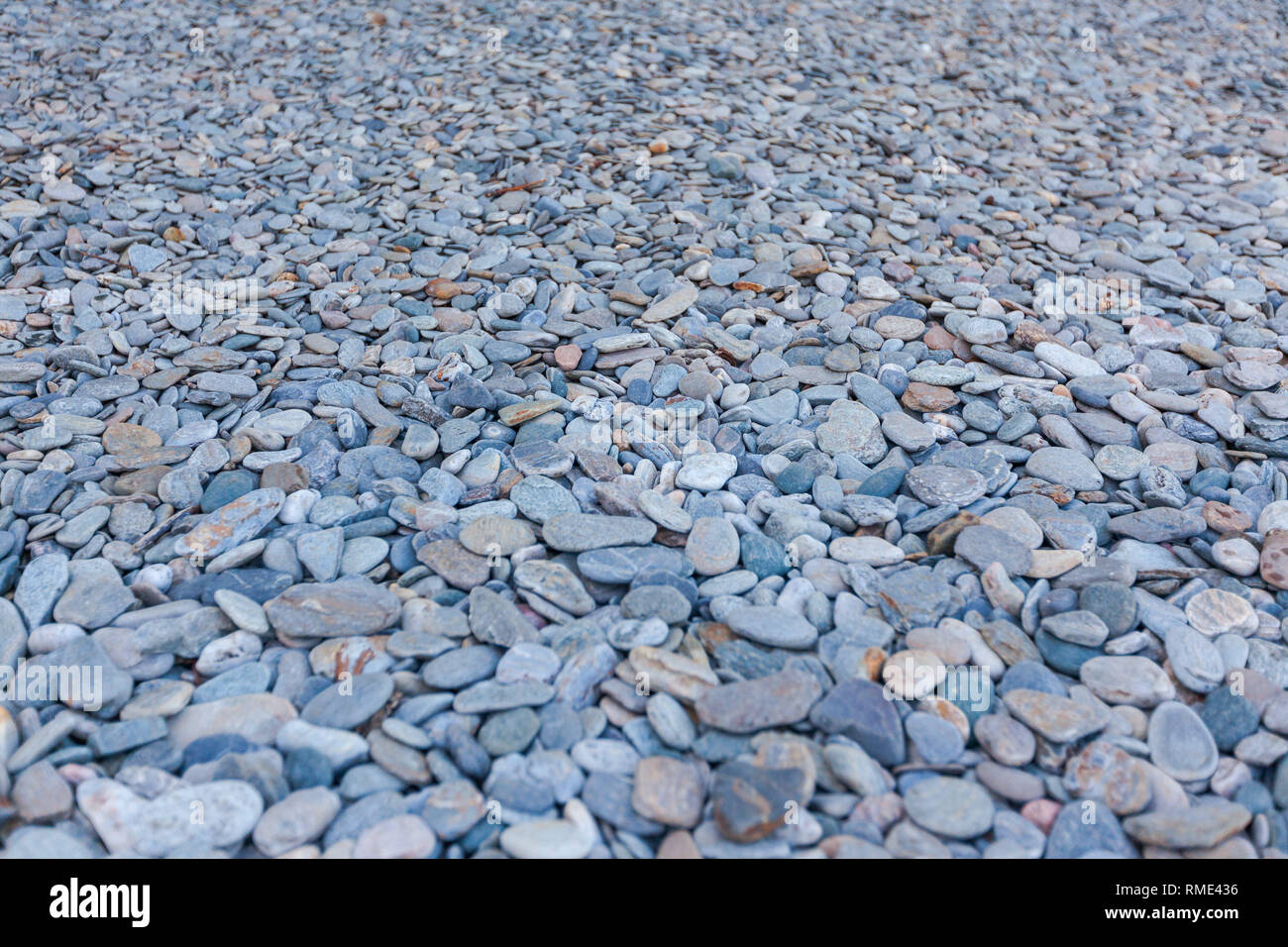 Round rocks on a beach Stock Photo - Alamy