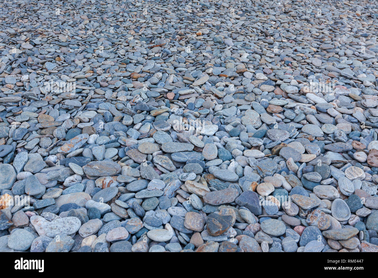 Round rocks on a beach Stock Photo - Alamy