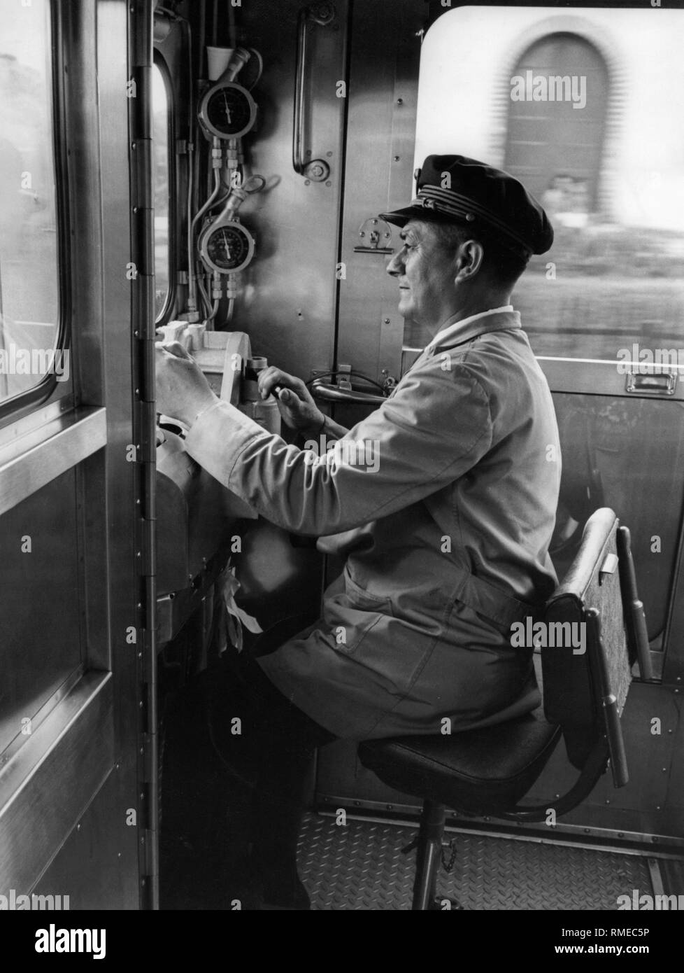 Engine driver in his cab Stock Photo - Alamy