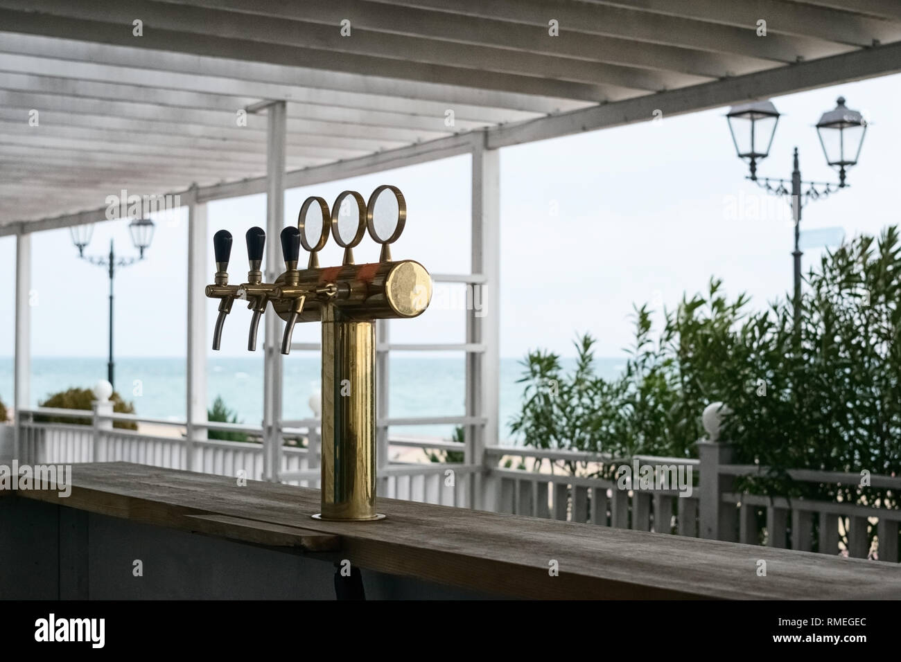 Bar counter with beer column with three taps in a closed bar on the ...