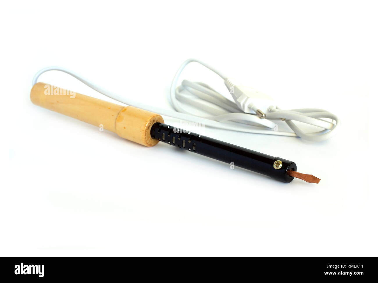 Electric soldering iron with a wooden handle and a white wire with a ...