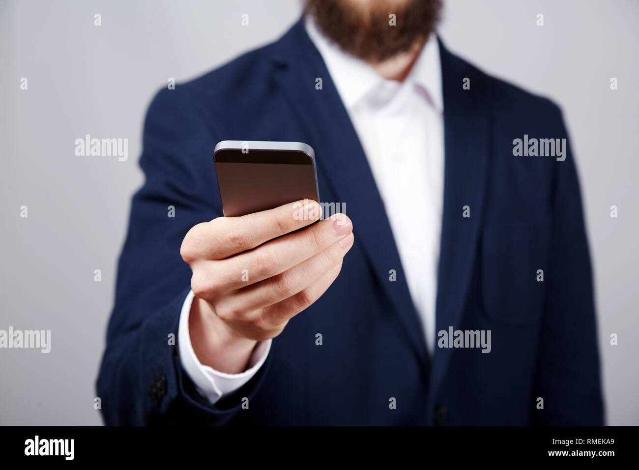 Worker at grey studio background Stock Photo - Alamy