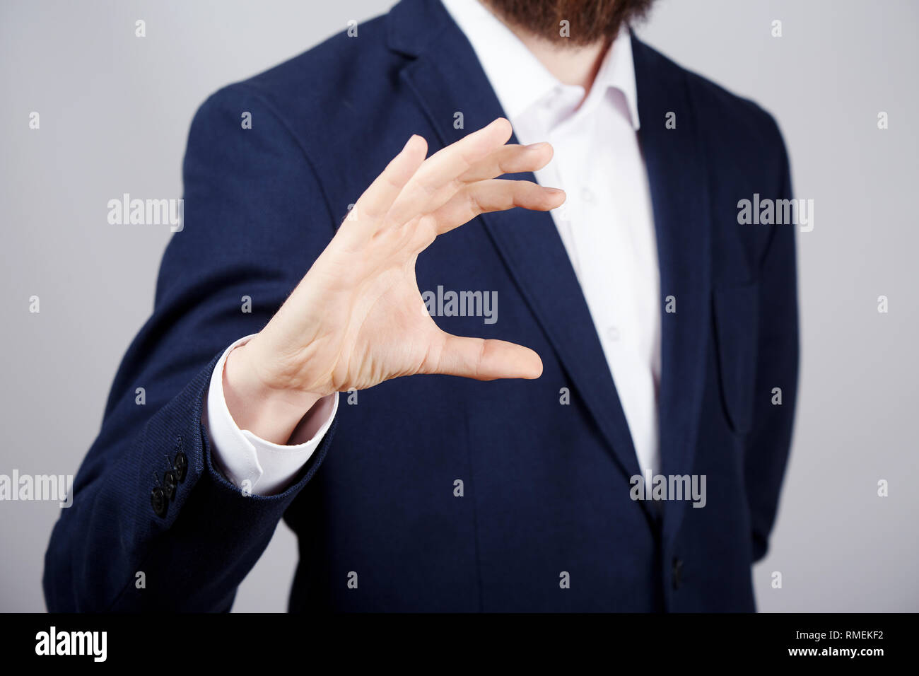 Worker at grey studio background Stock Photo - Alamy