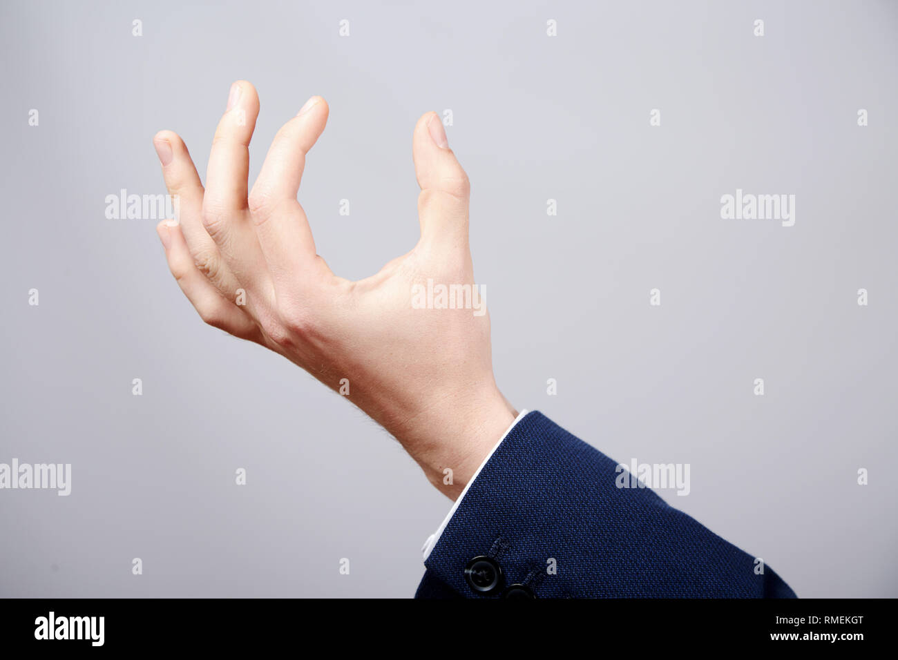 Worker at grey studio background Stock Photo - Alamy