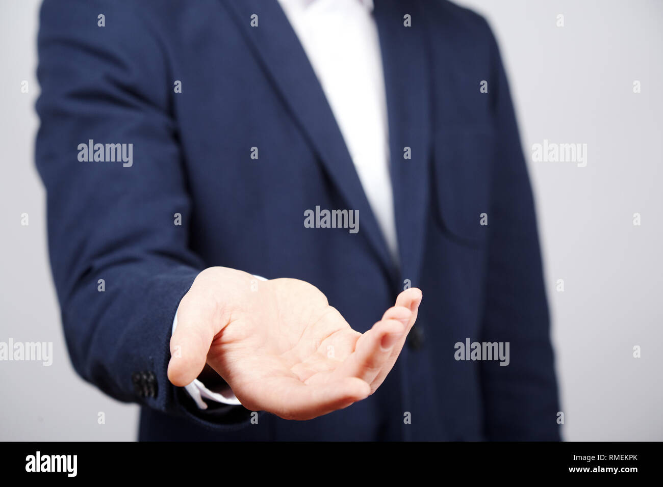 Worker at grey studio background Stock Photo - Alamy