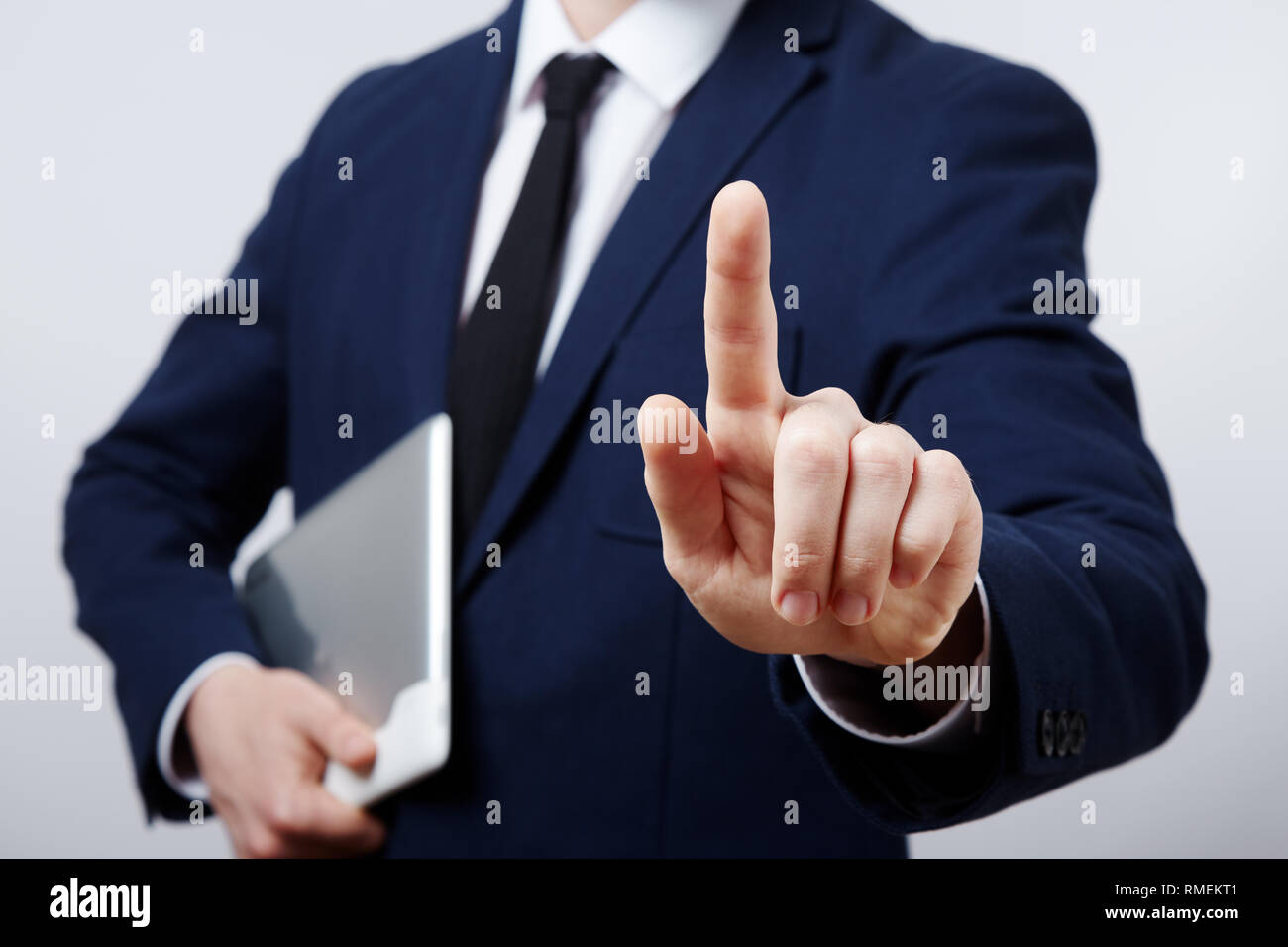 Worker at grey studio background Stock Photo - Alamy