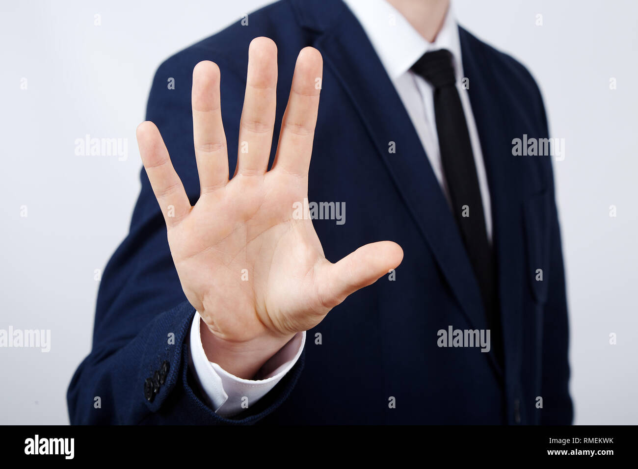 Worker at grey studio background Stock Photo - Alamy