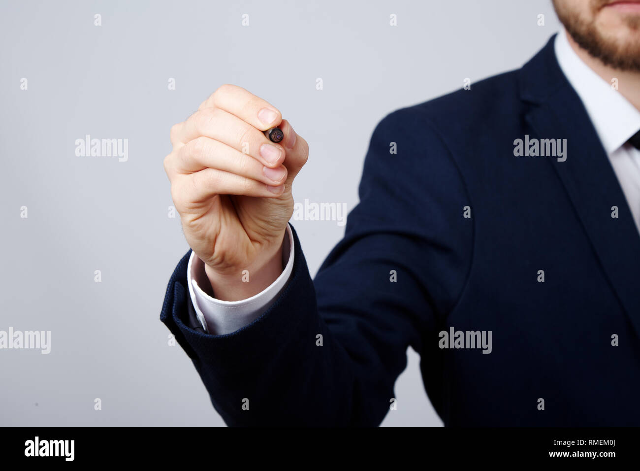 Worker at grey studio background Stock Photo - Alamy