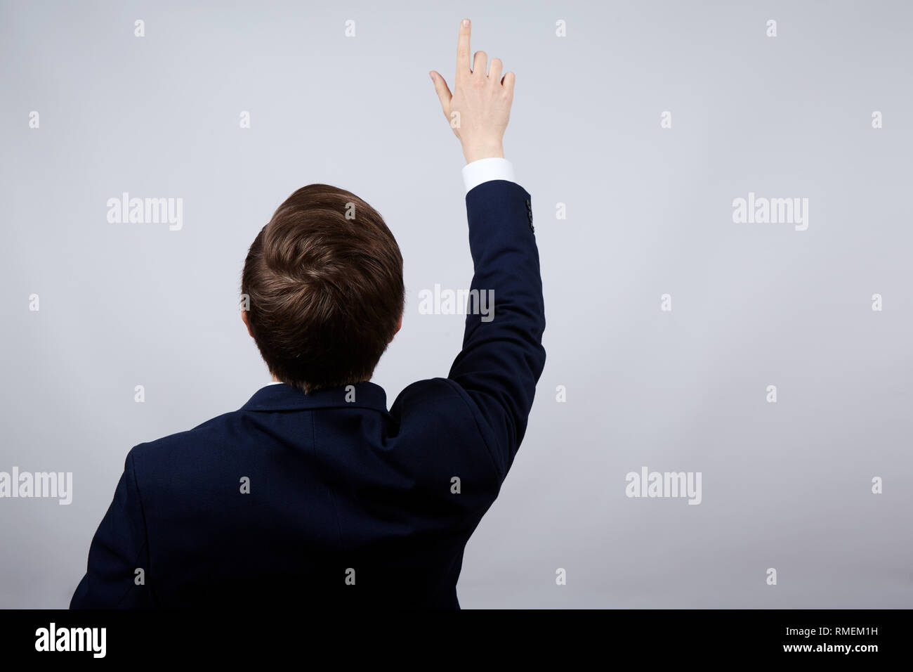 Worker at grey studio background Stock Photo - Alamy