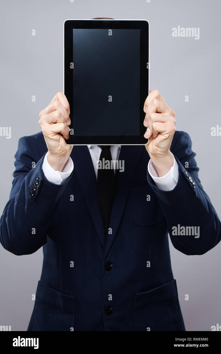 Worker at grey studio background Stock Photo - Alamy