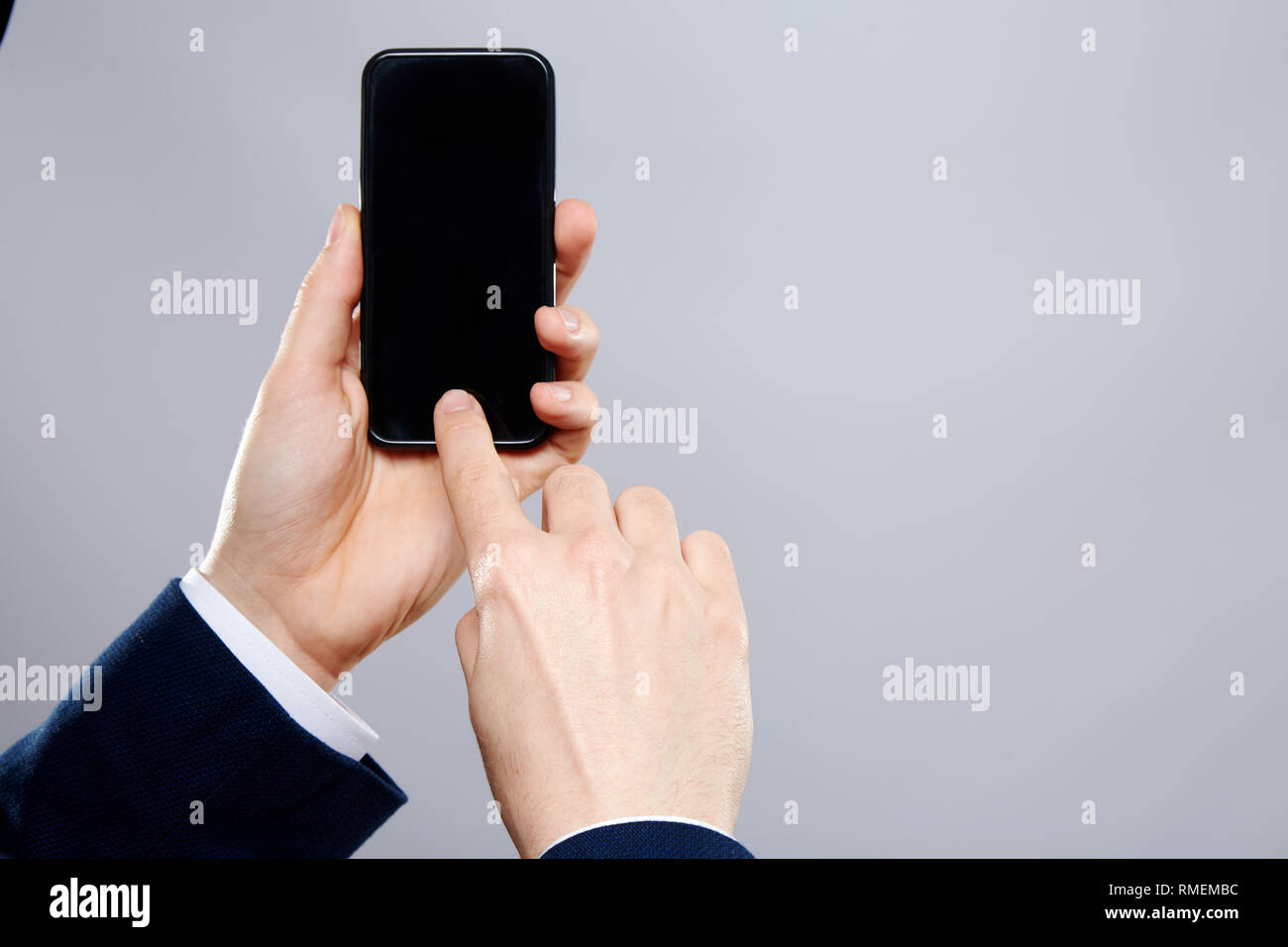 Worker at grey studio background Stock Photo - Alamy