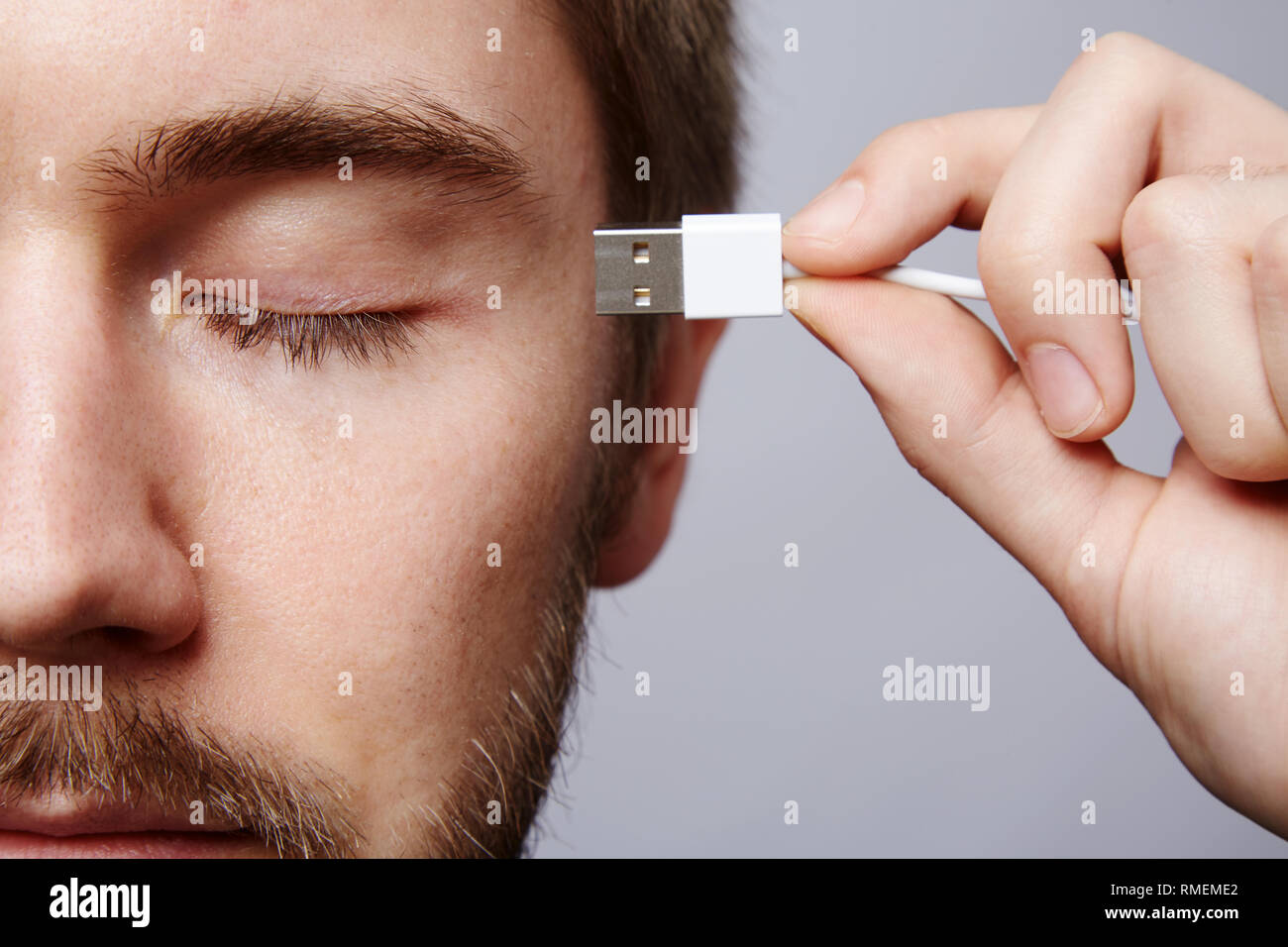 Worker at grey studio background Stock Photo - Alamy