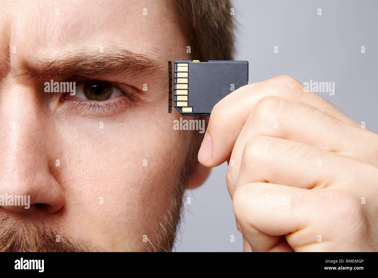 Worker at grey studio background Stock Photo - Alamy