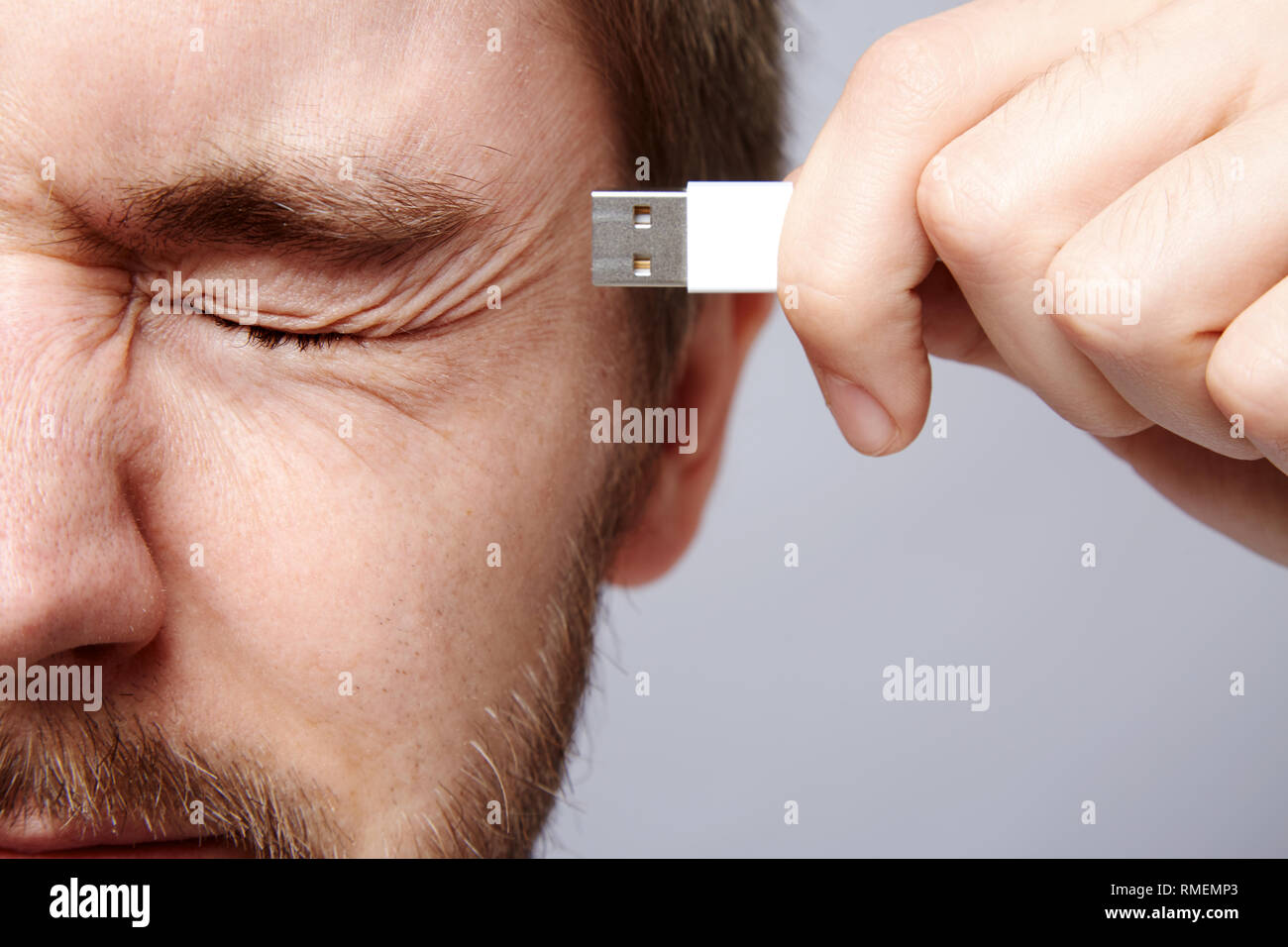 Worker at grey studio background Stock Photo - Alamy