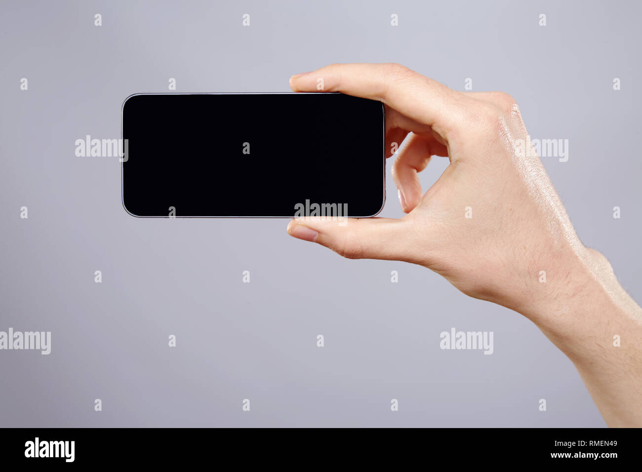 Worker at grey studio background Stock Photo - Alamy