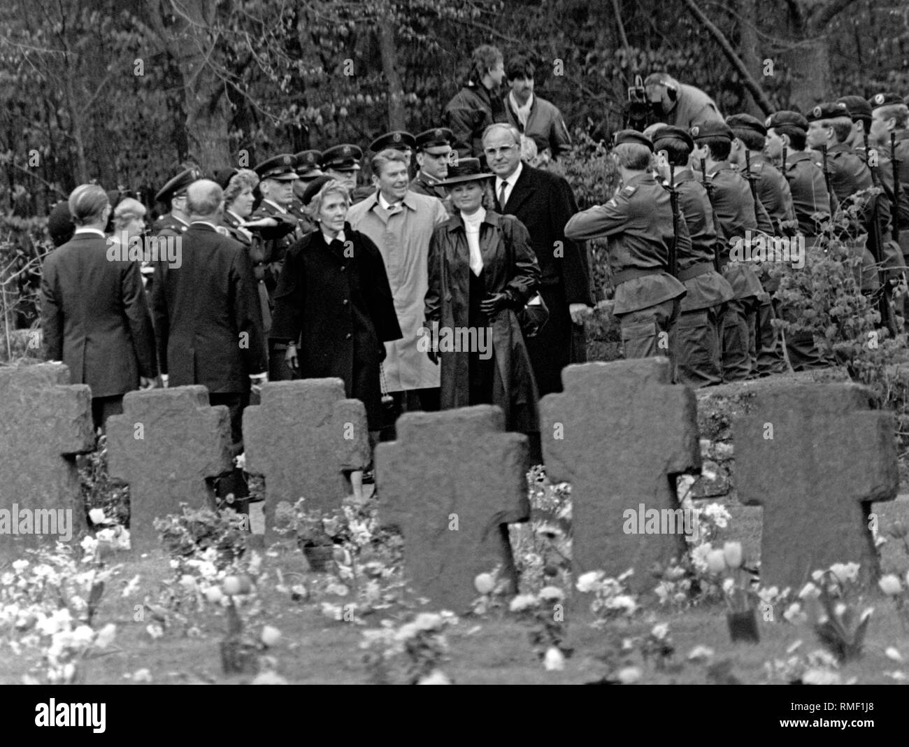On a path lined by American and German soldiers (from left) Nancy ...
