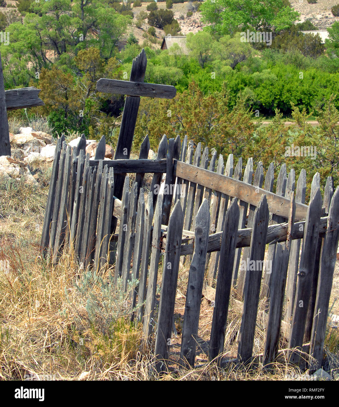 Rustic wooden fence surrounded a very old grave at the El Rancho del ...