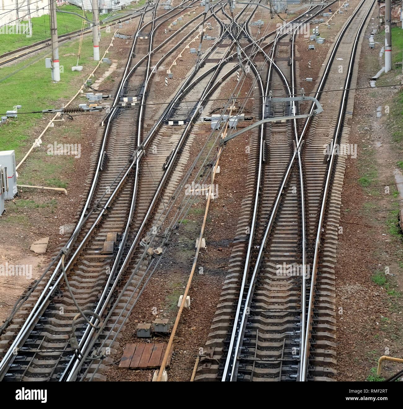 Industrial landscape with railroad tracks on concrete railway sleepers ...