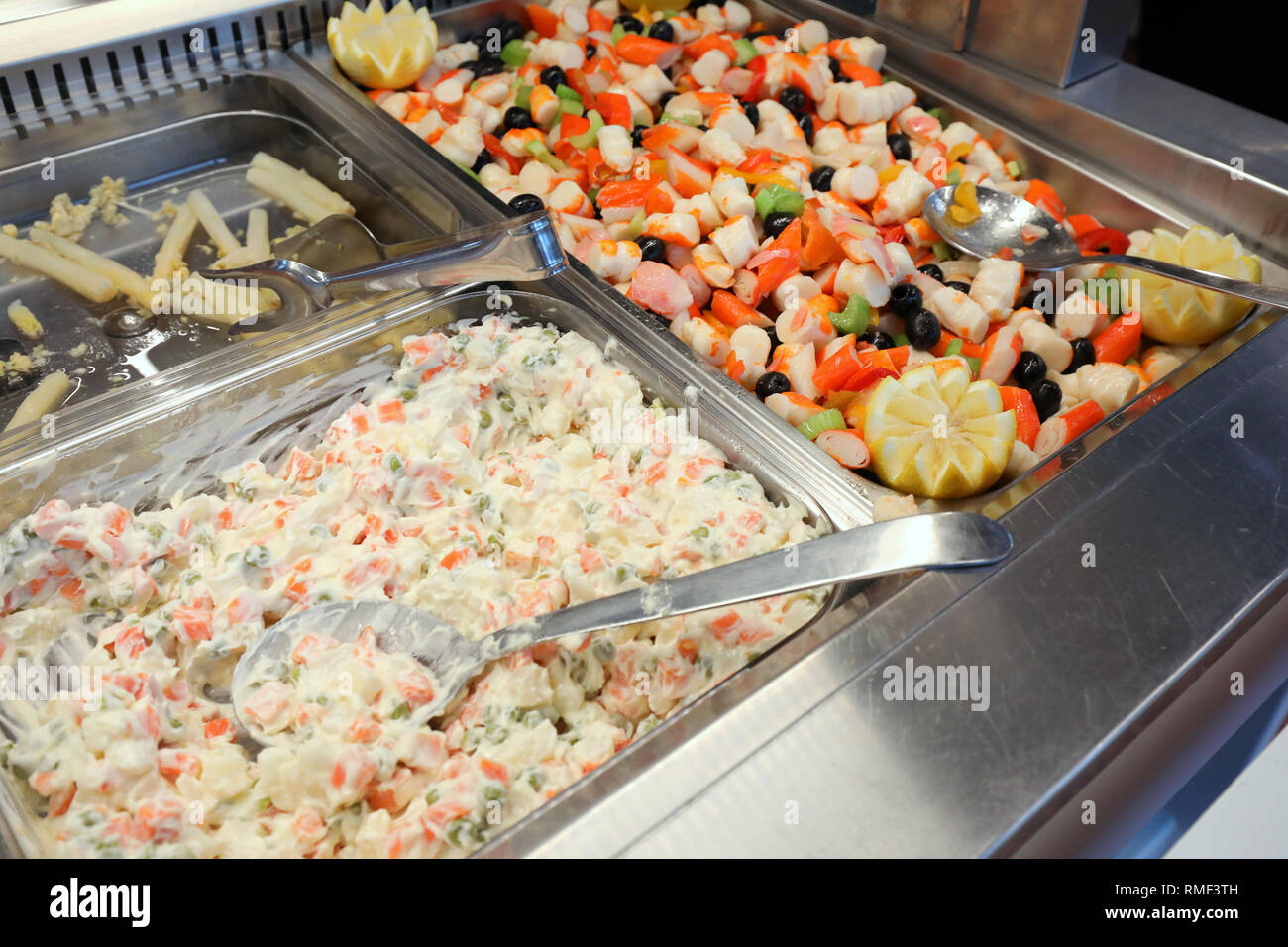 self service restaurant with many raw and cooked foods such as fish ...