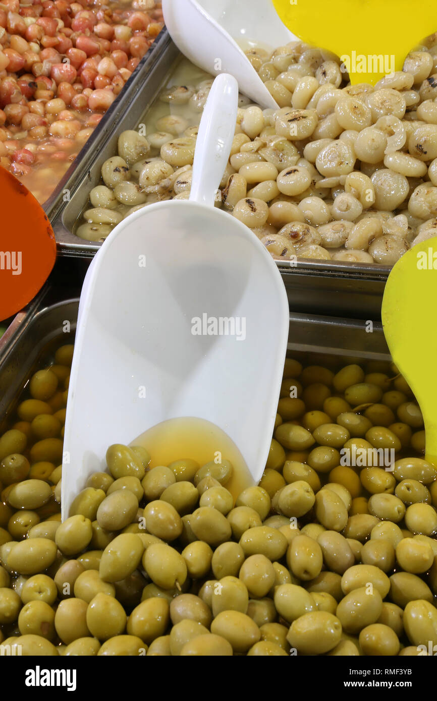 stand of Mediterranean products with olives and onions in oil Stock ...