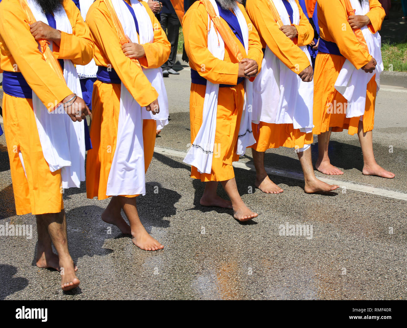 many people of sikh religion without shoes on the street Stock Photo ...