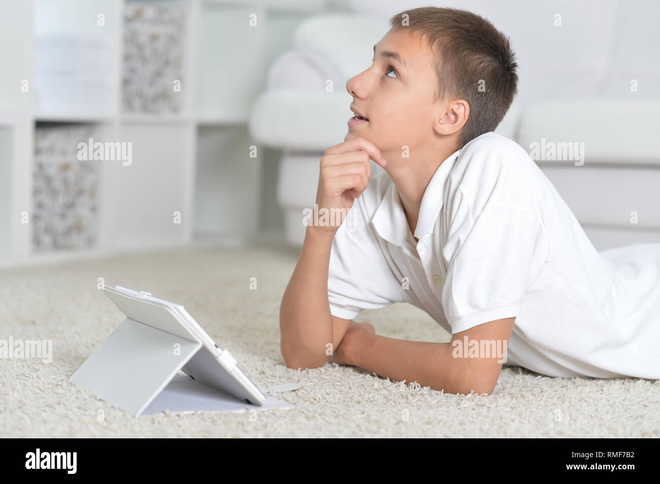 Portrait of a young boy with the tablet Stock Photo - Alamy