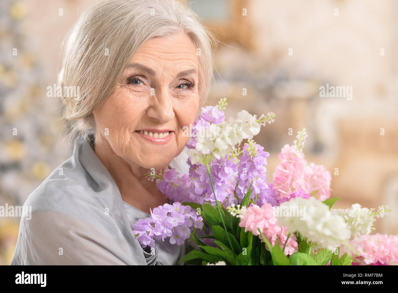 Beautiful old woman flowers hi-res stock photography and images - Alamy