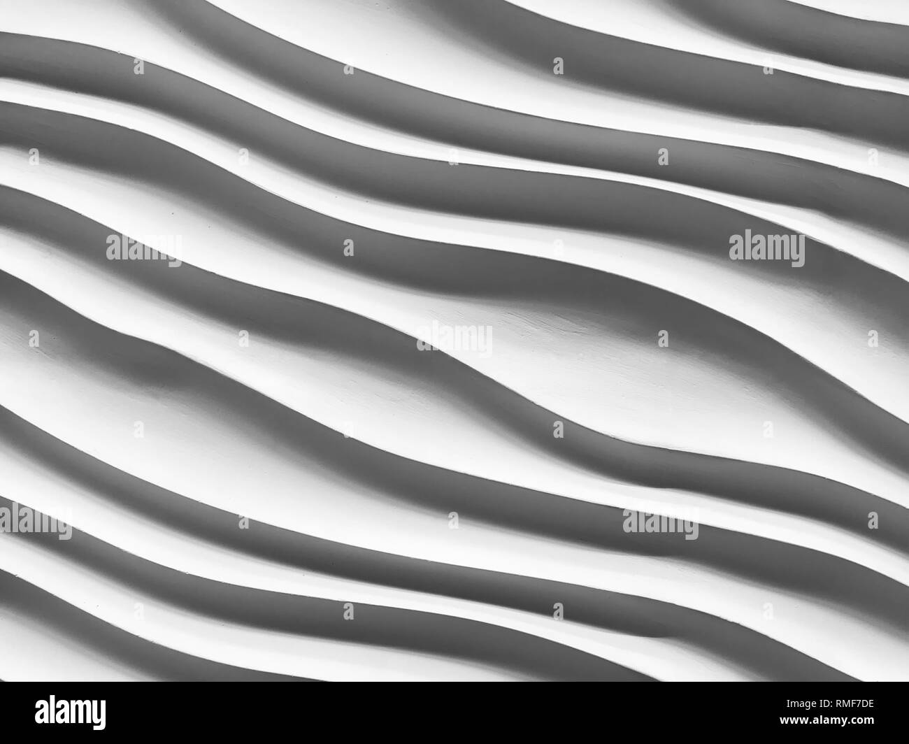 abstract striped of stone texture, curve sculpture. Close-up of black ...