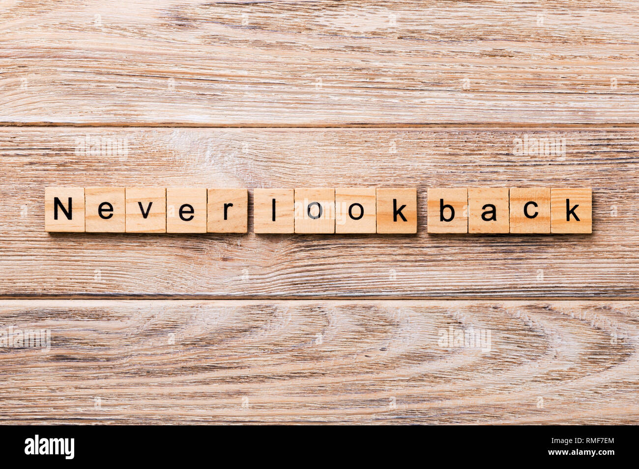 never look back word written on wood block. never look back text on ...